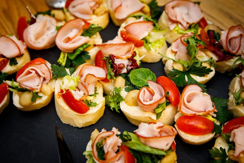 Set of Beautiful Small Sandwiches on Black Stone Plates. Buffet Table ...