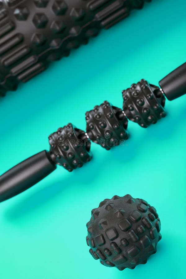 A Set of Black Bumpy Foam Massage Rollers, Body Rollers, Rubber Balls ...