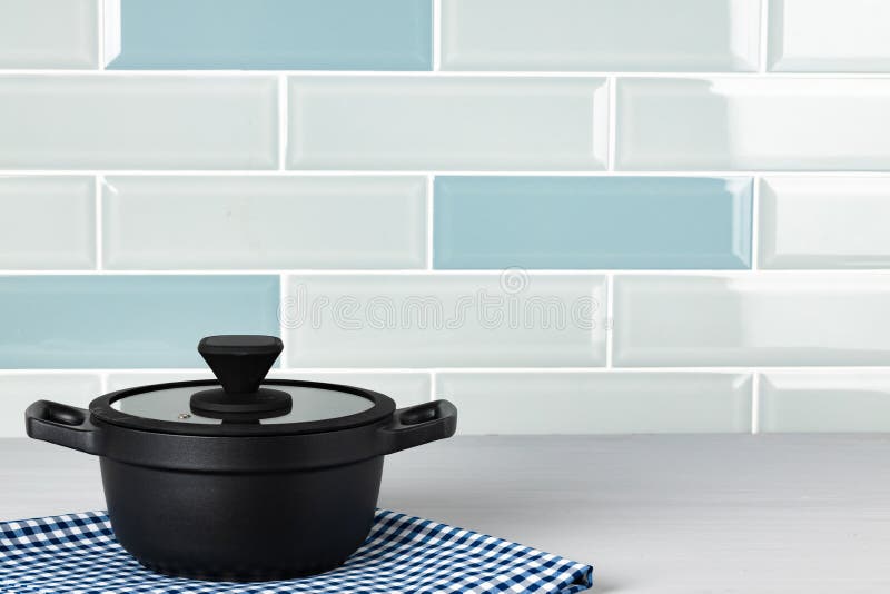 Set of Black Cookware on Kitchen Counter Stock Image - Image of kitchen ...