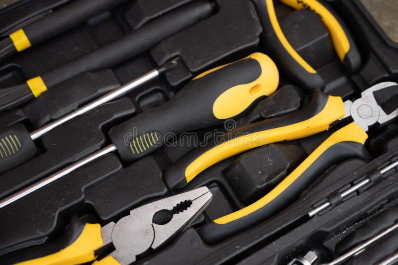 A Set of Black and Yellow Tools Stock Photo - Image of hand, yellow ...