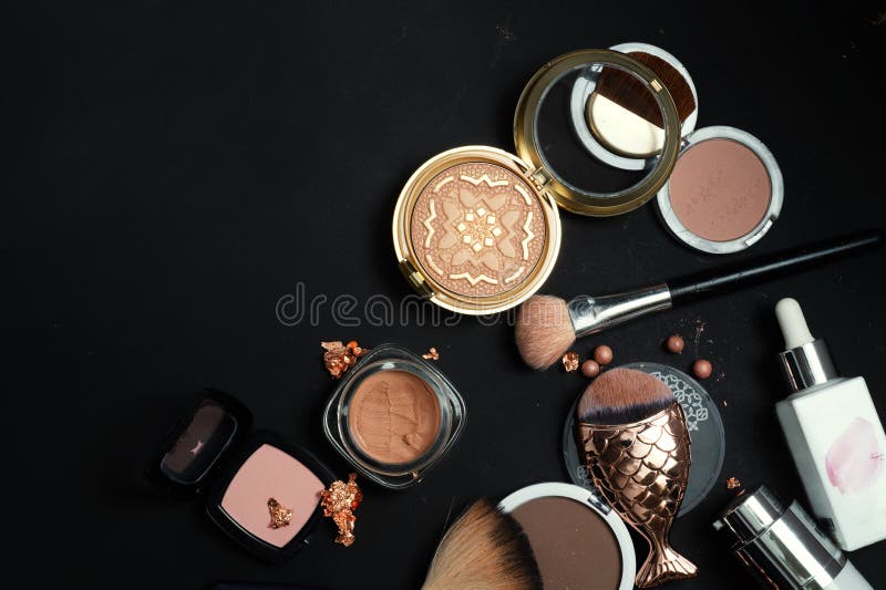 Set of Bronze Powders with Makeup Brushes on Black Background Stock ...