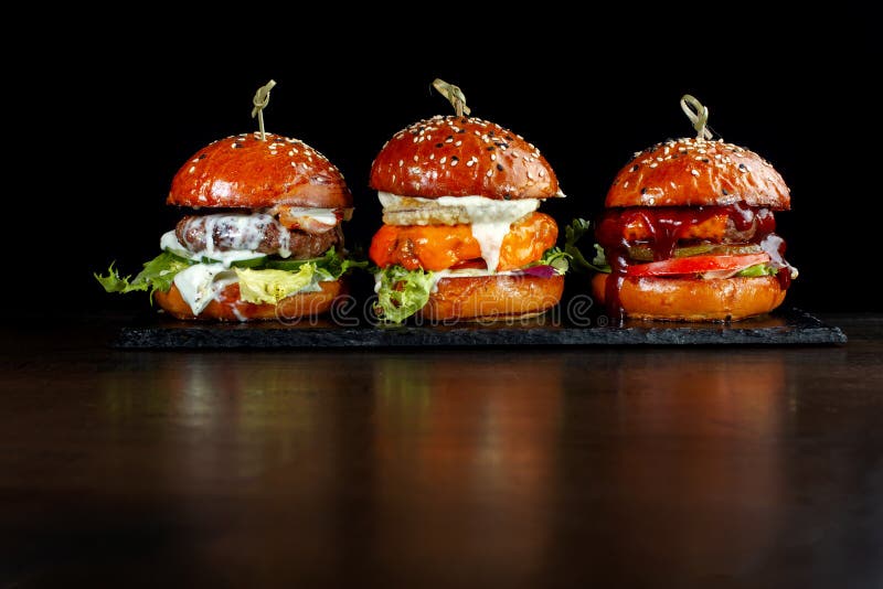 Set Burgers with Beef. on a Black Background. Stock Image - Image of ...