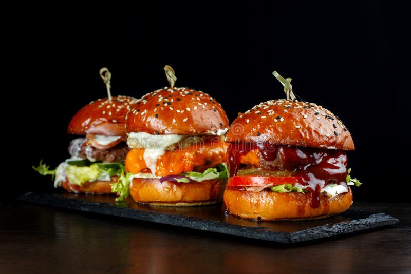 Set Burgers with Beef. on a Black Background. Stock Image - Image of ...