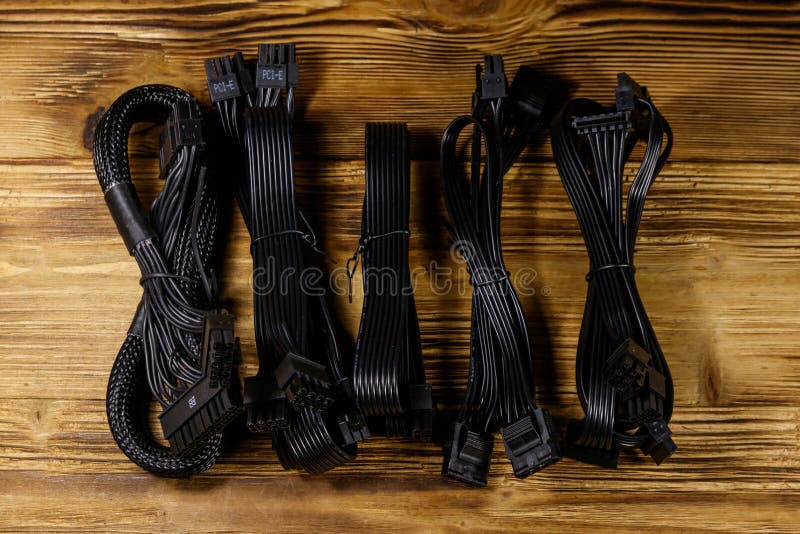 Set of Cables for Computer PSU on Wooden Desk Stock Photo - Image of ...