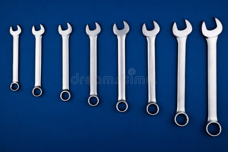 Set Chrome Spanner Keys Lying Side by Side on Blue Background. Flat Lay ...