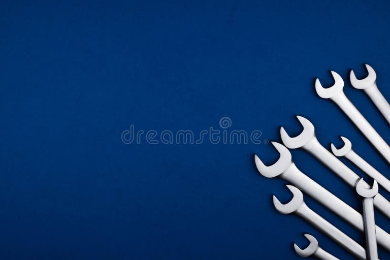 Set Chrome Spanner Keys Lying Side by Side on Blue Background. Flat Lay ...