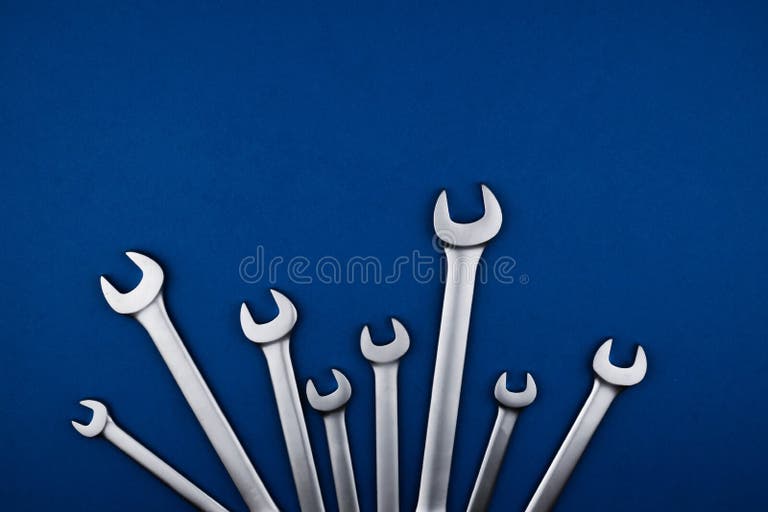 Set Chrome Spanner Keys Lying Side by Side on Blue Background. Flat Lay ...