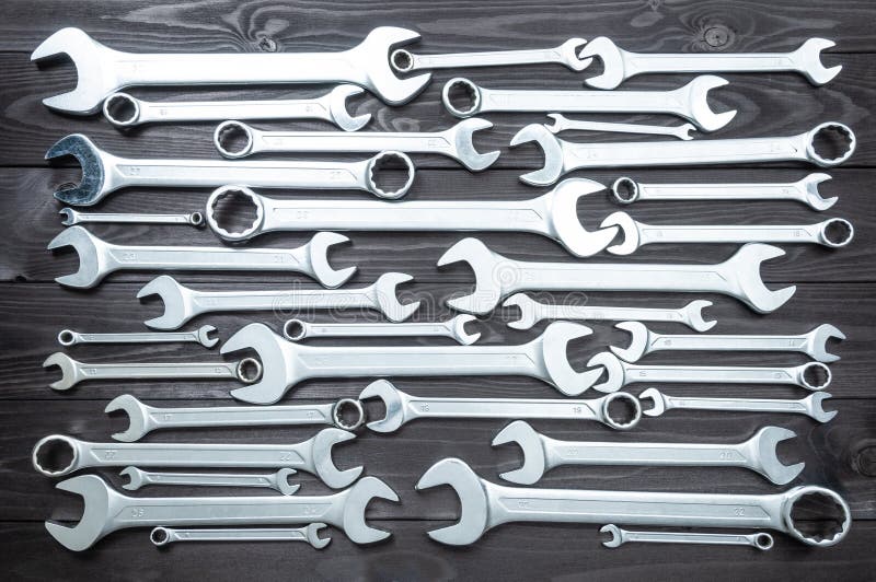 Set of Chromed Wrenches on a Dark Wooden Workbench. Top View Stock ...