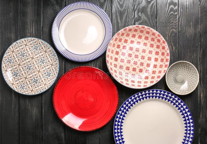 Set of Clean Color Plates on Table Stock Image - Image of serving, dish ...