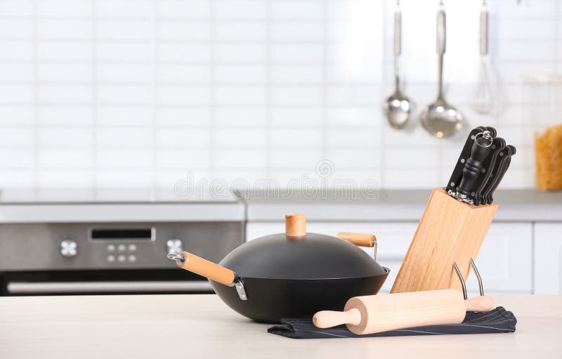 Set of Clean Cookware and Utensils on Table in Kitchen Stock Photo ...