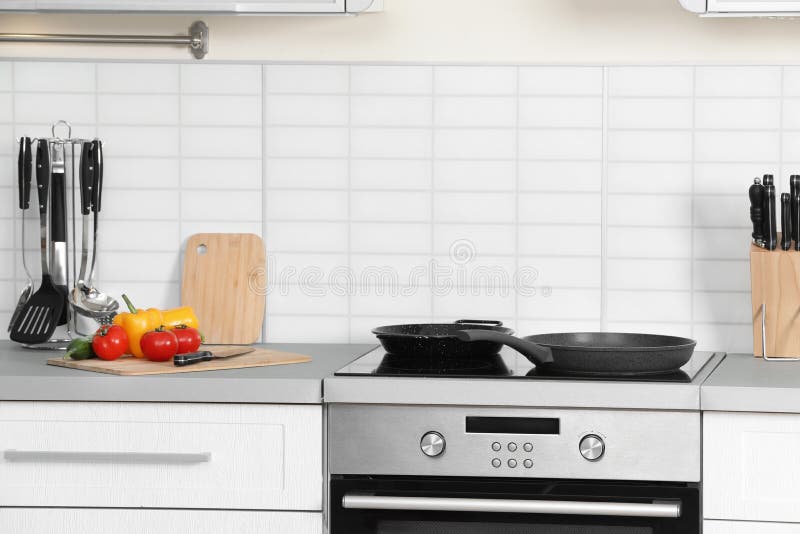 Set of Clean Cookware and Utensils on Table in Kitchen. Stock Image ...