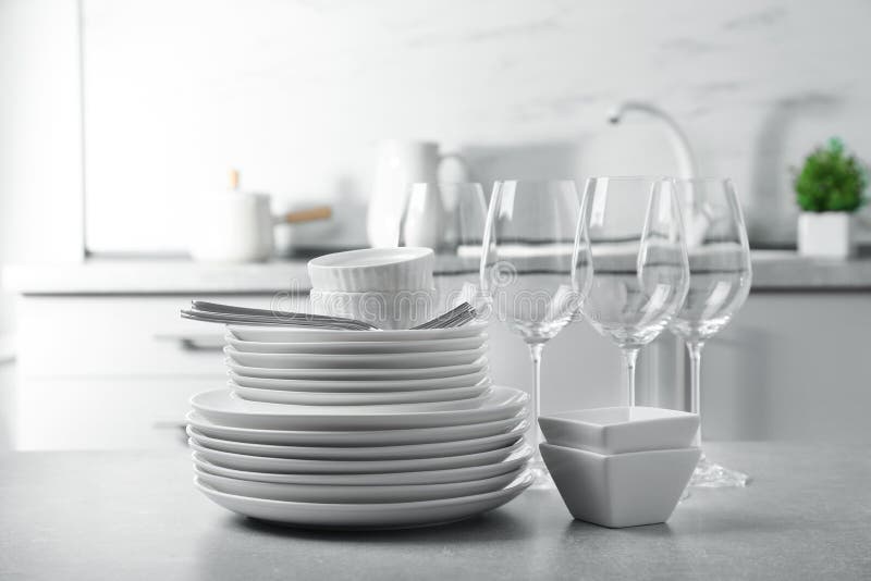 Set of Clean Dishes and Cutlery on Table Stock Photo - Image of clear ...