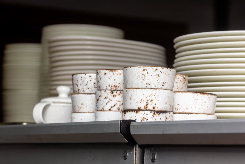 Set of Clean Dishes and Cutlery on Table in Kitchen Stock Image - Image ...
