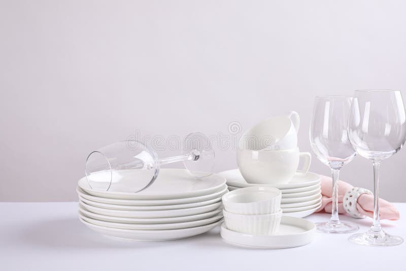 Set of Clean Dishes on Table Stock Photo - Image of pile, modern: 170800600