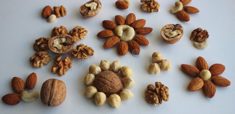 Flowers Pattern Made of Laid Out Nuts of Different Varieties on a White ...