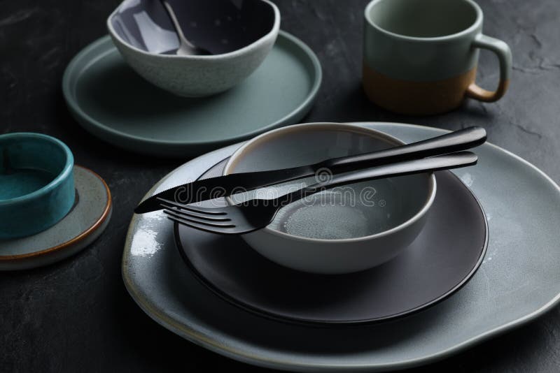 Set of Clean Tableware on Black Table Stock Photo - Image of modern ...
