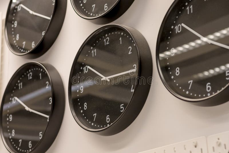 Many Different Wall Clock on the Wall .Set of Clockfaces . Concept of ...