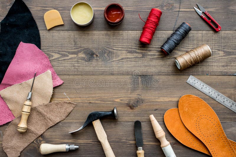 Set of Cobbler Tools on Brown Wooden Desk Background Top View Stock ...