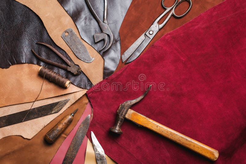 Set of Cobbler Tools on a Pieces of Colorful Leather. Stock Photo ...