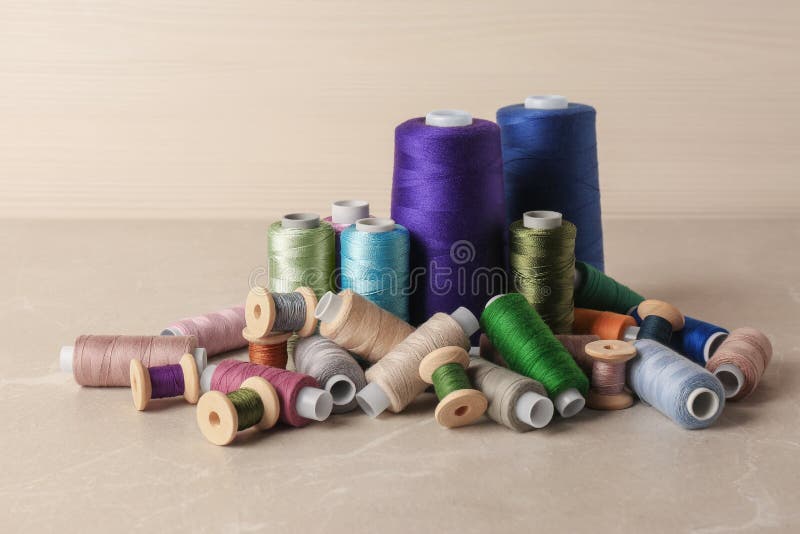 Set of Color Sewing Threads on Light Grey Table Stock Photo - Image of ...
