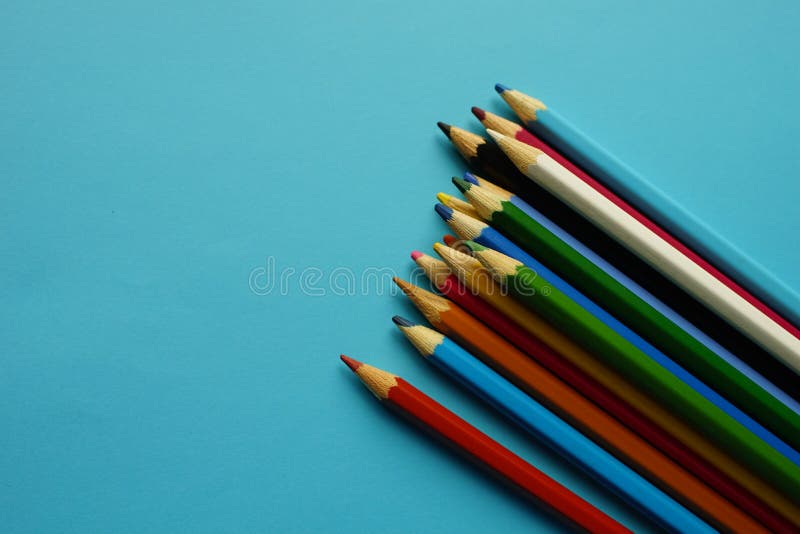 A Set of Colored Pencils on a Blue Table Stock Photo - Image of rainbow ...