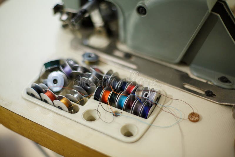 A Set of Colored Thread for a Sewing Machine. Workplace Seamstress ...