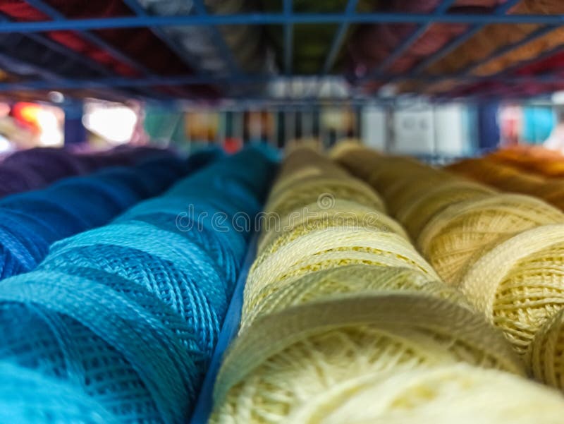Set of Colored Threads for Sewing on Coils. Pile of Big Colorful Spools ...