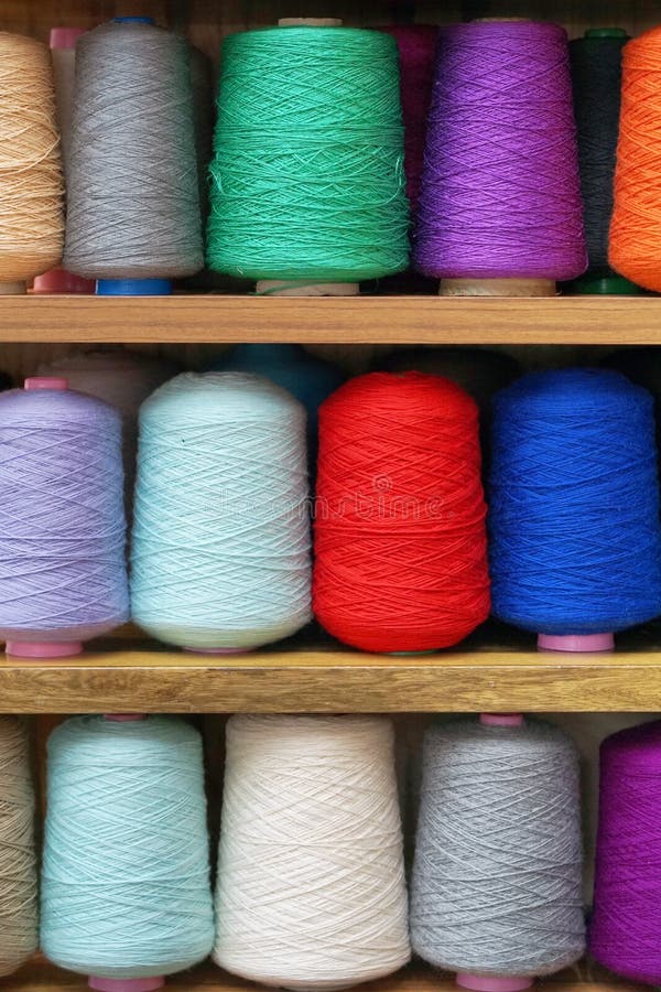 Multi-colored Large Spools of Thread in a Row. Spools of Colored Thread ...