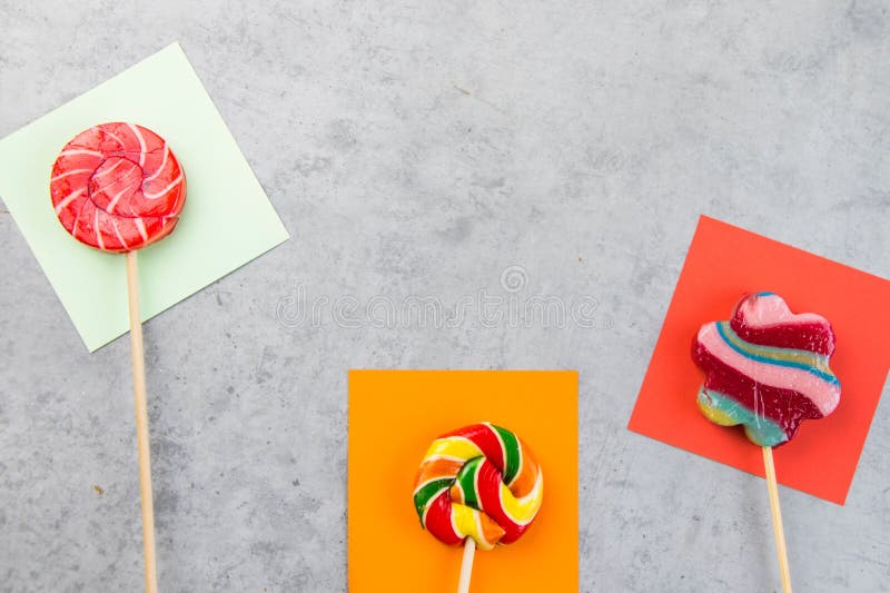 Set of Colorful Lollipops Placed Atop a Stack of Sticky Notes Stock ... Set of Colorful Lollipops Placed Atop a Stack of Sticky Notes Stock ...