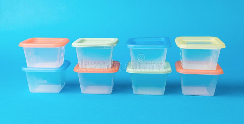 A Set of Colorful Plastic Containers on a Blue Background Stock Image ...