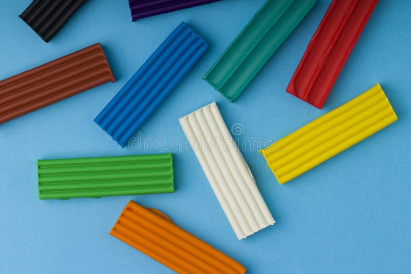 Set of Colorful Plasticine Sticks on Blue Background Stock Photo ...