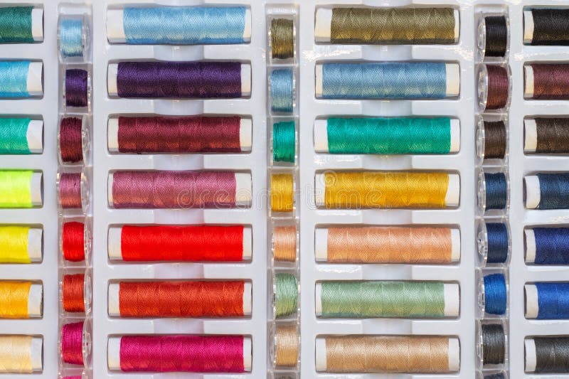 A Set of Colorful Threads and Plastic Bobbins for Sewing Machines ...
