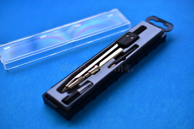 Set of Compasses in a Box on a Blue Background Stock Image - Image of ...