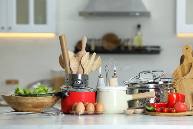 Set of Cooking Utensils and Products on White Table in Kitchen Stock ...