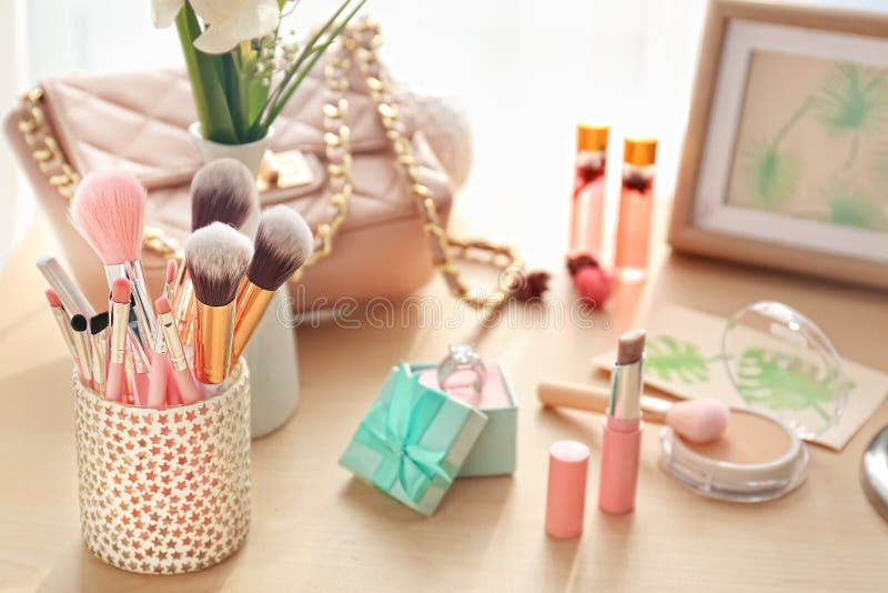 Set of Decorative Cosmetics with Makeup Brushes on Table Indoors Stock ...