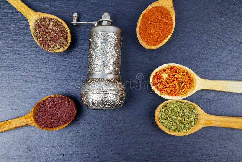 Set of Different Aromatic Spices and Spice Mill on Black Slate. Top ... Set of Different Aromatic Spices and Spice Mill on Black Slate. Top ...