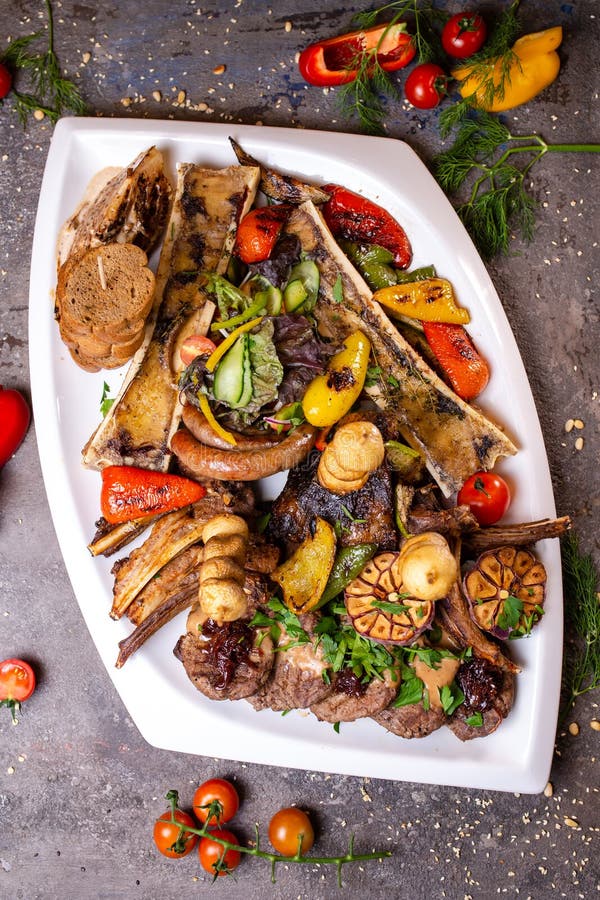 A Set of Different Beef Meat Dishes on a White Plate Stock Image ...