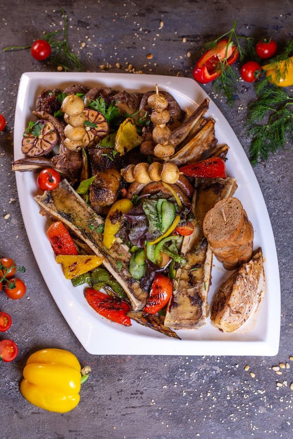 A Set of Different Beef Meat Dishes on a White Plate Stock Photo ...