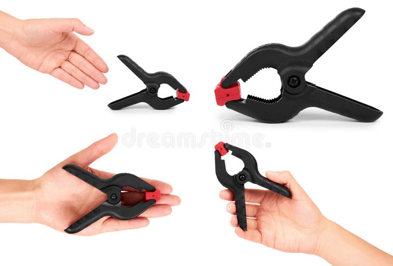 Black Plastic Clamp in Hand Isolated on White Background Stock Photo ...