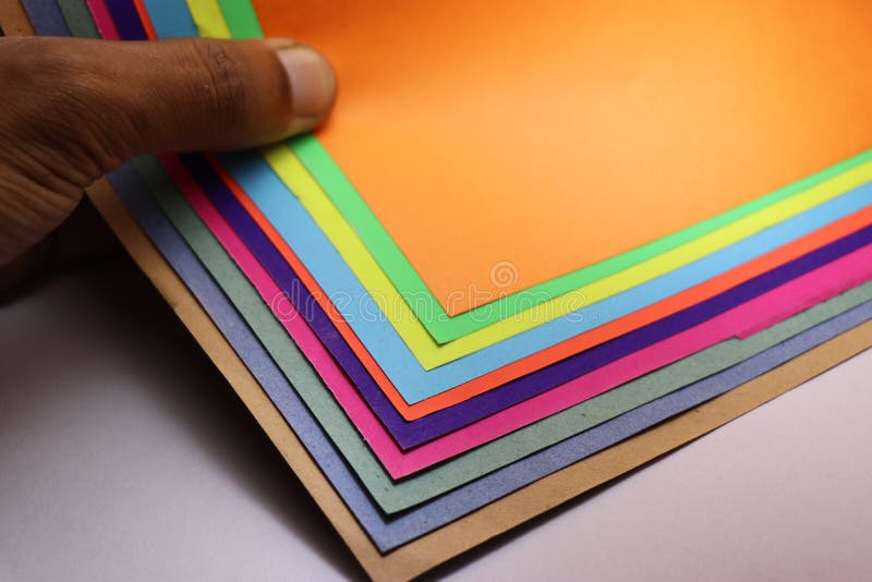 Set of Different Colored Color Papers Held in Hand Stock Photo - Image ...