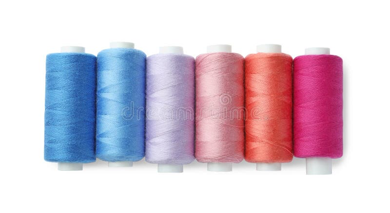 Set of Different Colorful Sewing Threads on White Background, Top View ... Set of Different Colorful Sewing Threads on White Background, Top View ...