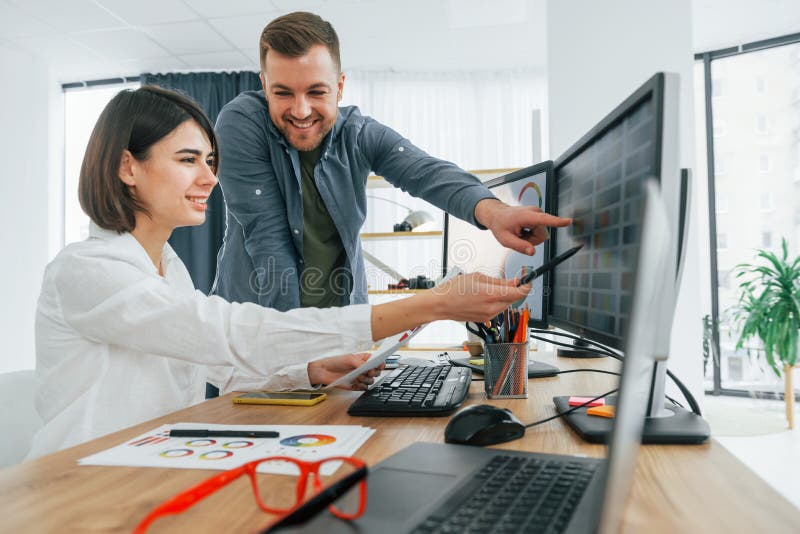 Set of Different Colors. Two Designers Working Together in the Office ...