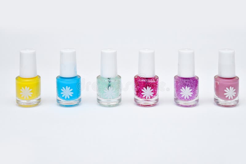 Set of Different Coloured Nail Polishes on a White Background Stock ...