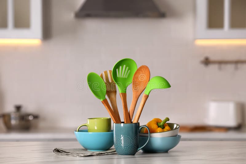 Set of Different Cooking Utensils and Ceramic Dishes on White Table in ...