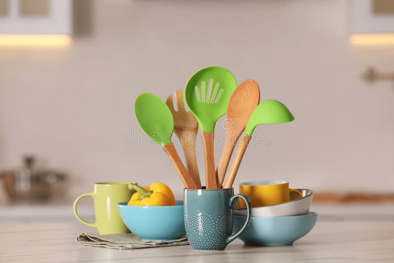 Set of Different Cooking Utensils and Ceramic Dishes on White Table in ...