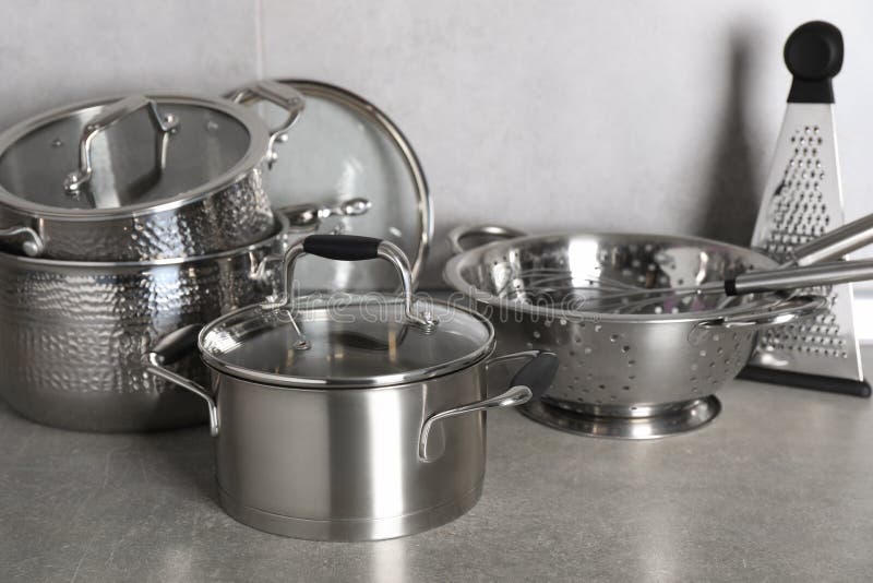 Set of Different Cooking Utensils on Grey Countertop in Kitchen Stock ...