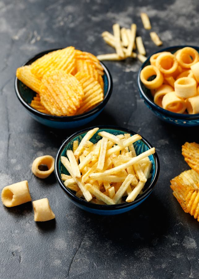 Set of Different Crispy Potato Chips in Bowls. Snack Food Stock Image ...