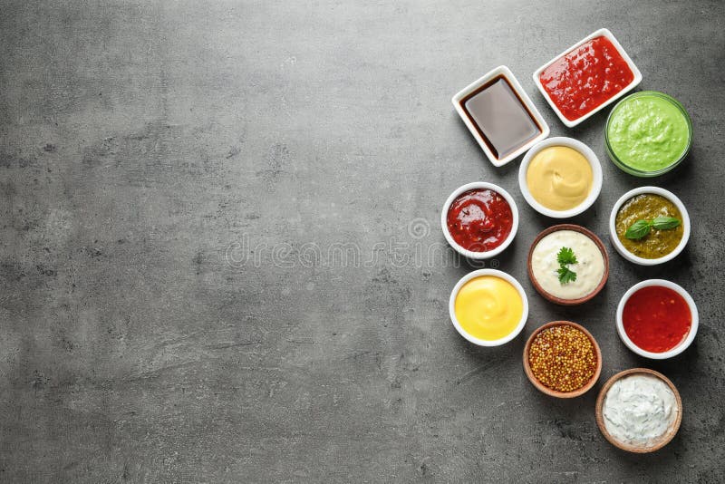 Set of Different Delicious Sauces on Grey Table, Top View Stock Photo ...