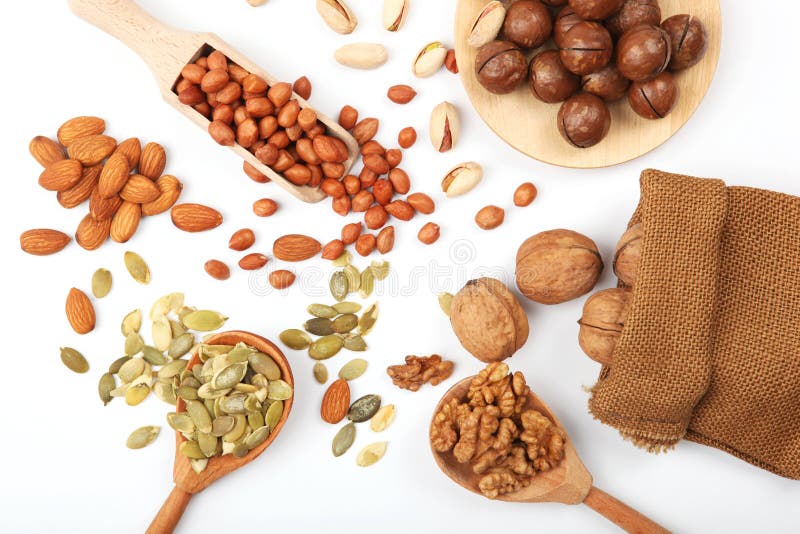 A Set of Different Nuts on the Table. Stock Photo - Image of bowl, nuts ...