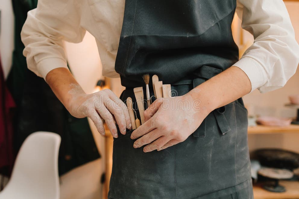 Set of Different Potters Instruments. Artisan Black Apron Holds ...